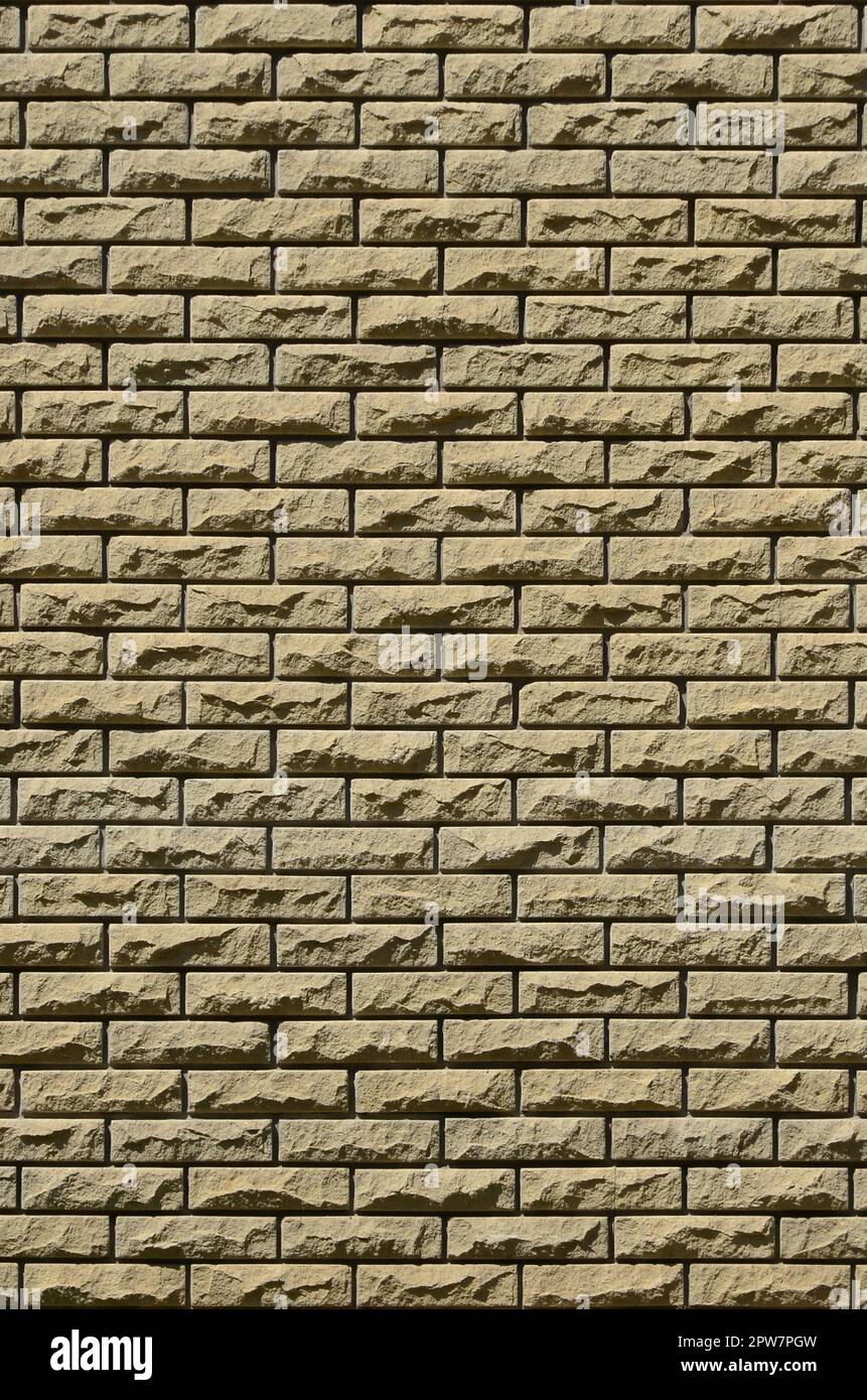 Texture of brick wall from relief stones under bright sunlight Stock ...