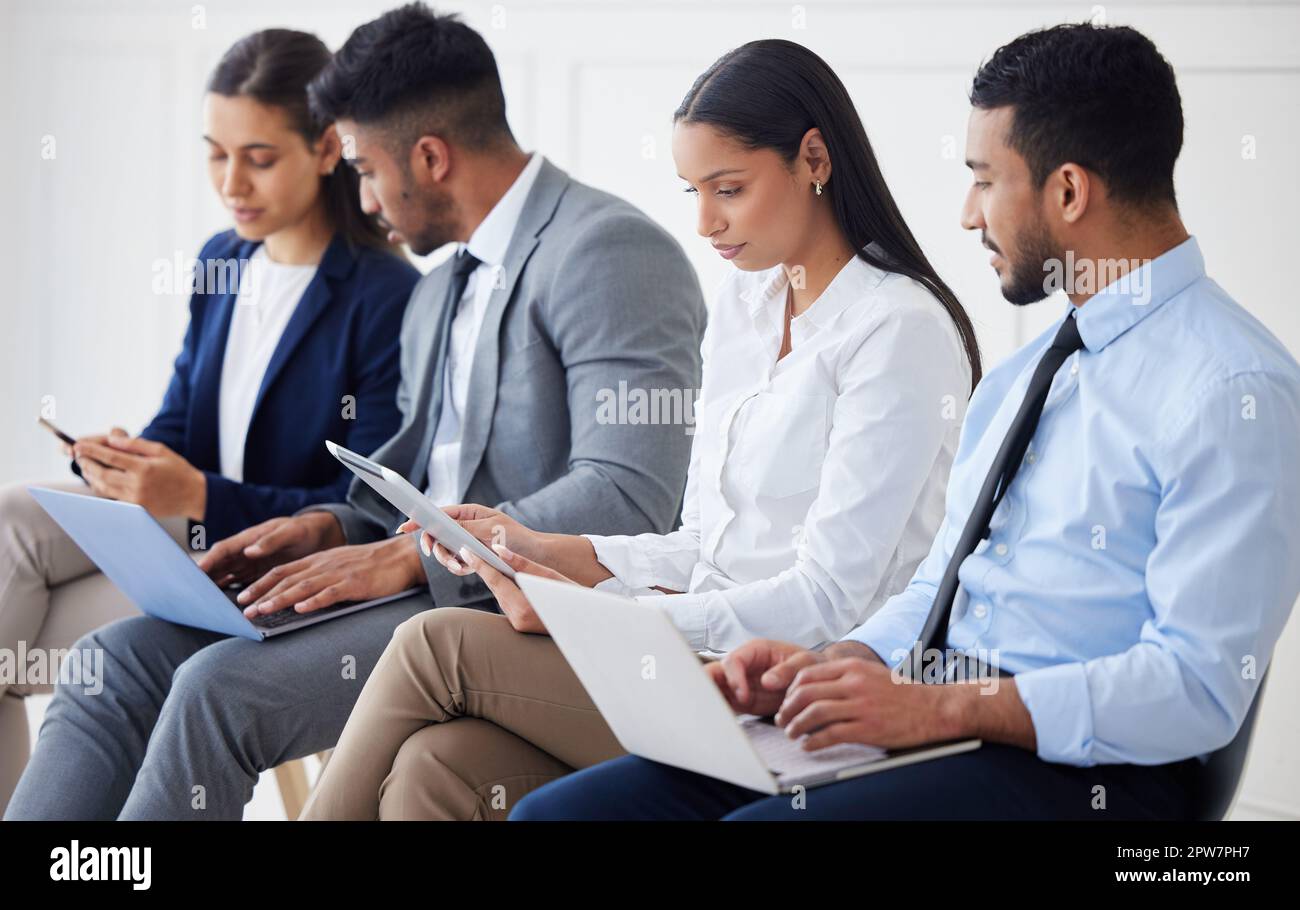 Group of diverse businesspeople waiting for interview and using ...