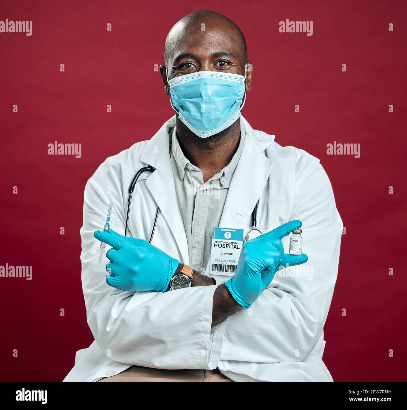 African american covid doctor holding corona vaccine and needle while ...