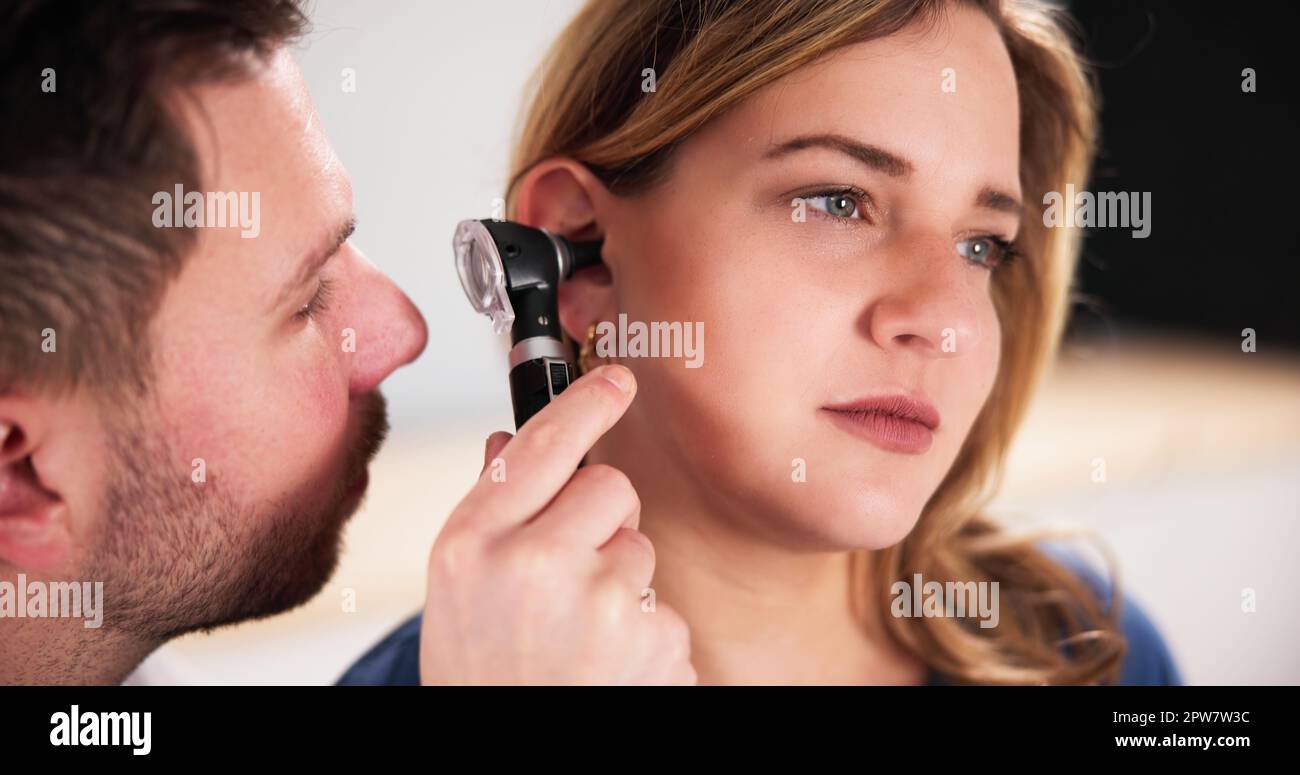 Otolaryngology Ear Check Using Otoscope. Doctor Examining Patient Stock ...