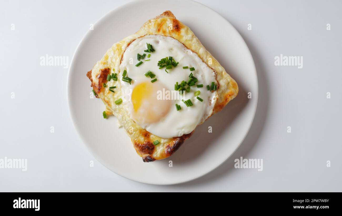 Hot French Traditional Croque madame sandwich for breakfast. Melted ...