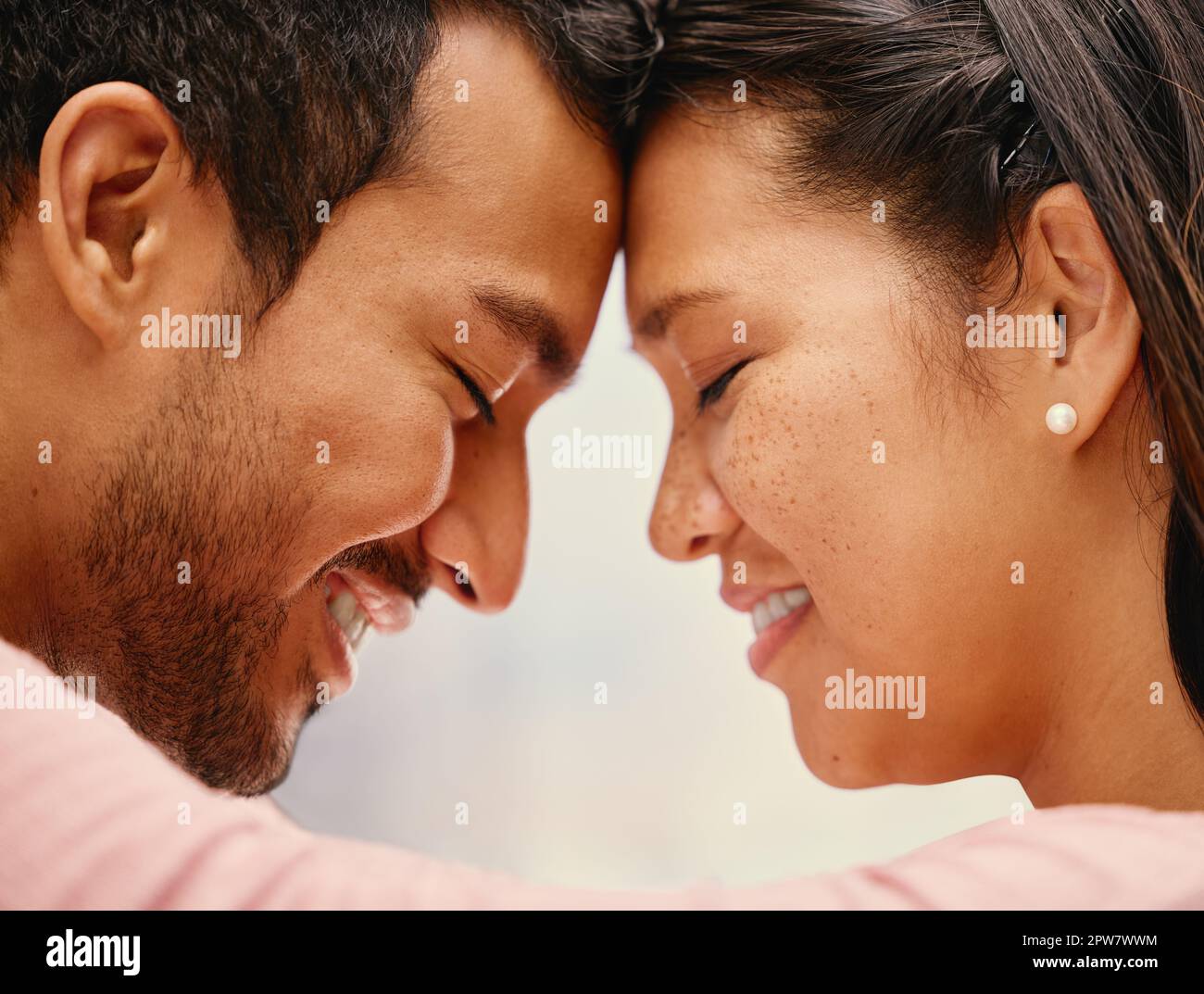 Closeup Of Mixed Race Man Loving His Asian Wife Headshot Of Hispanic