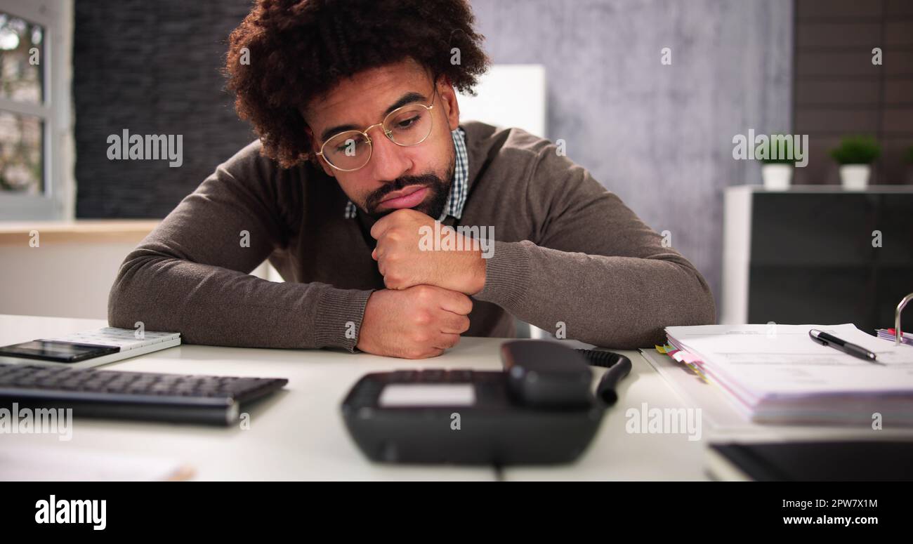 Waiting For Phone Call On Office Landline At Desk Stock Photo - Alamy