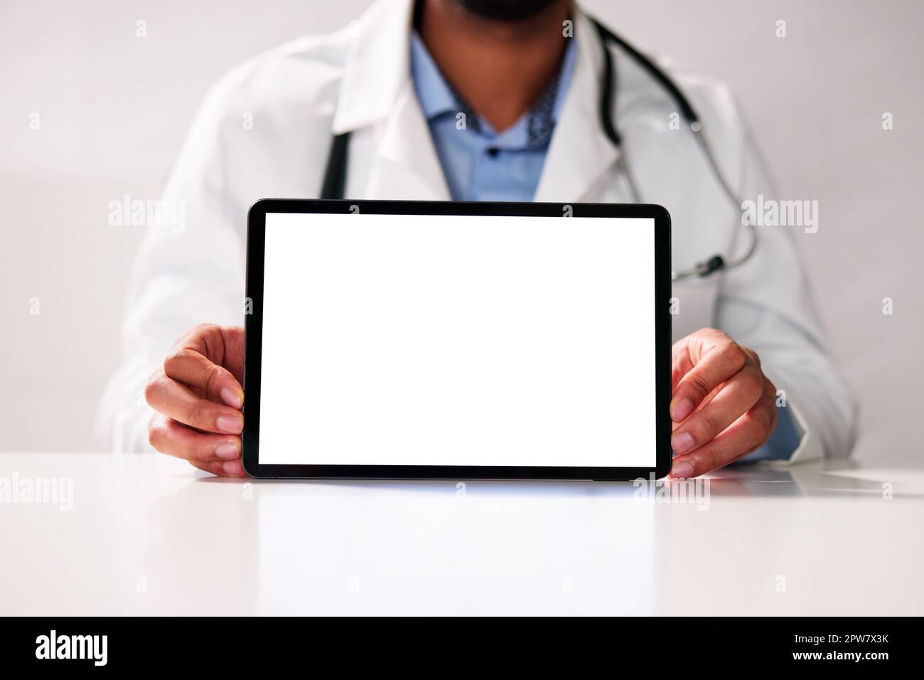 Doctor working using computer african hi-res stock photography and ...