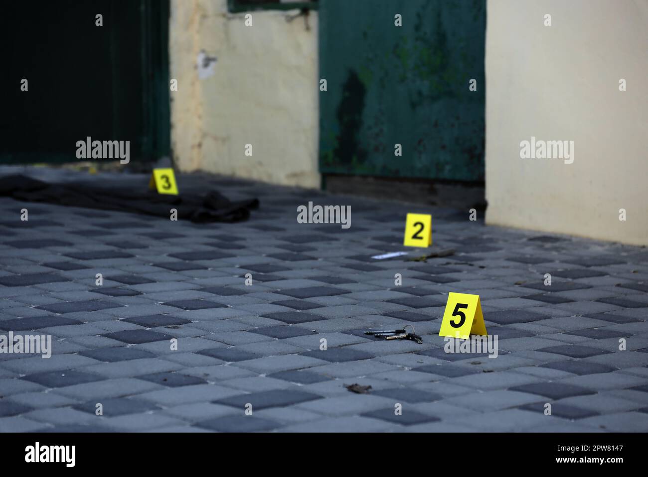 Evidence with yellow CSI marker for evidence numbering on the ...
