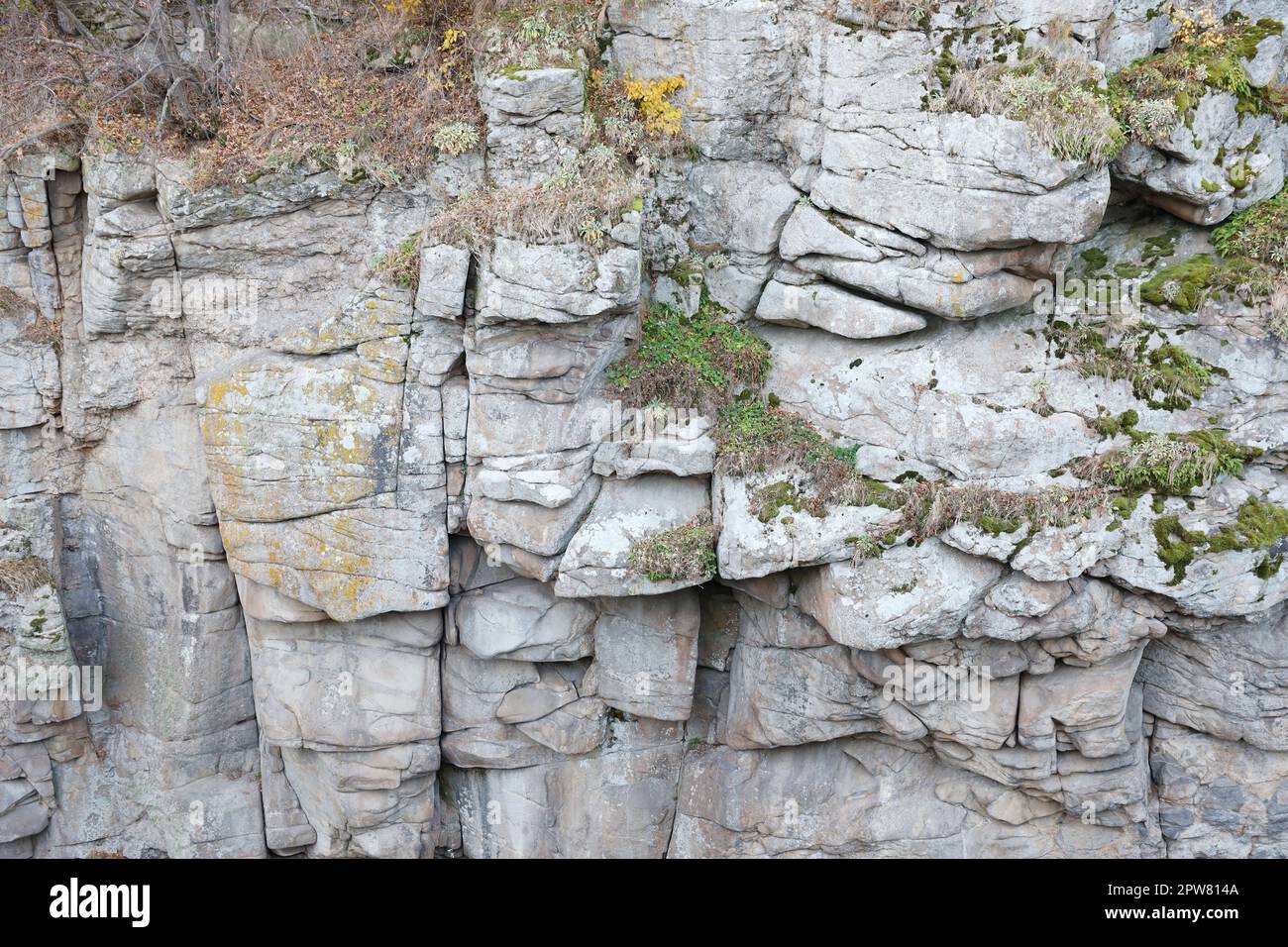 Light coarse natural rock stone background. Mining cliff rough front ...