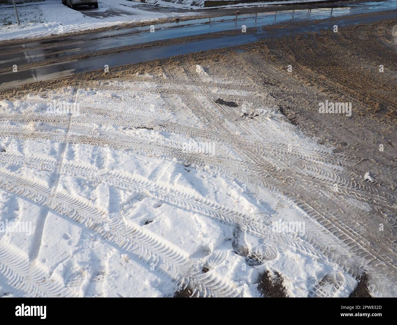 A fork or siding from a roundabout. Snowdrifts on the side of the road ...