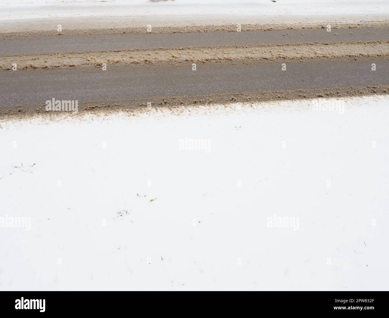 Snowdrifts on the side of the road. Bad weather and traffic. Snow on ...
