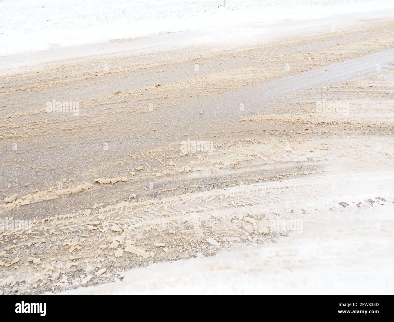 Snowdrifts on the side of the road. Bad weather and traffic. Snow on ...