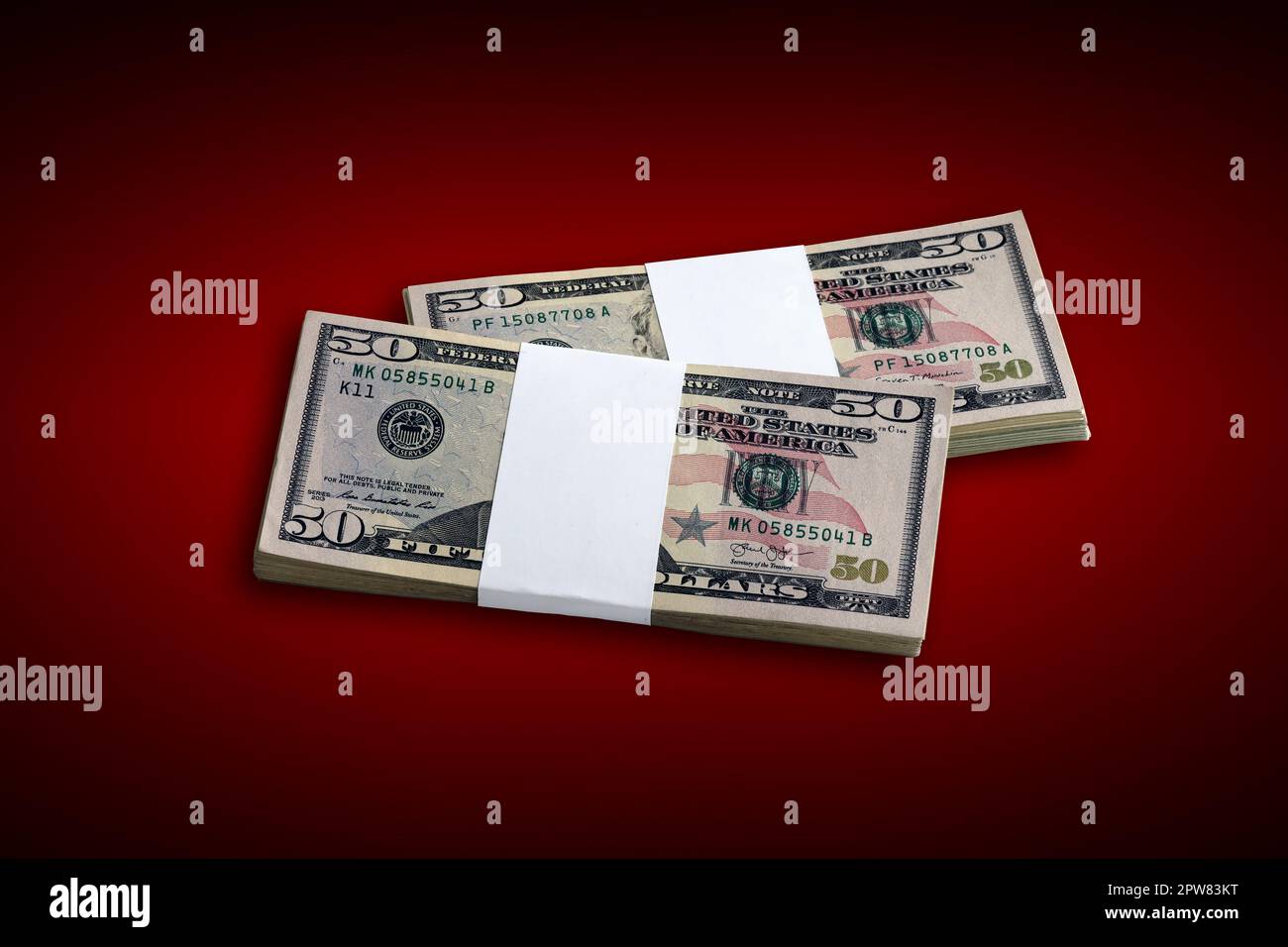 Bundle of US dollar bills on crimson red background. Pack of american ...