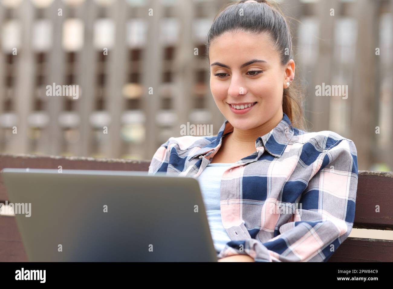 Young Woman Sitting On Toilet Using Laptop Highres Stock