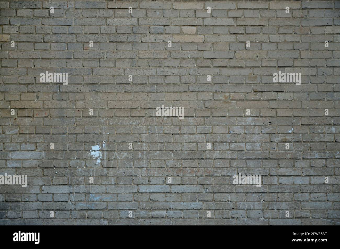 The texture of a dark wall from a variety of old and dirty brick ...
