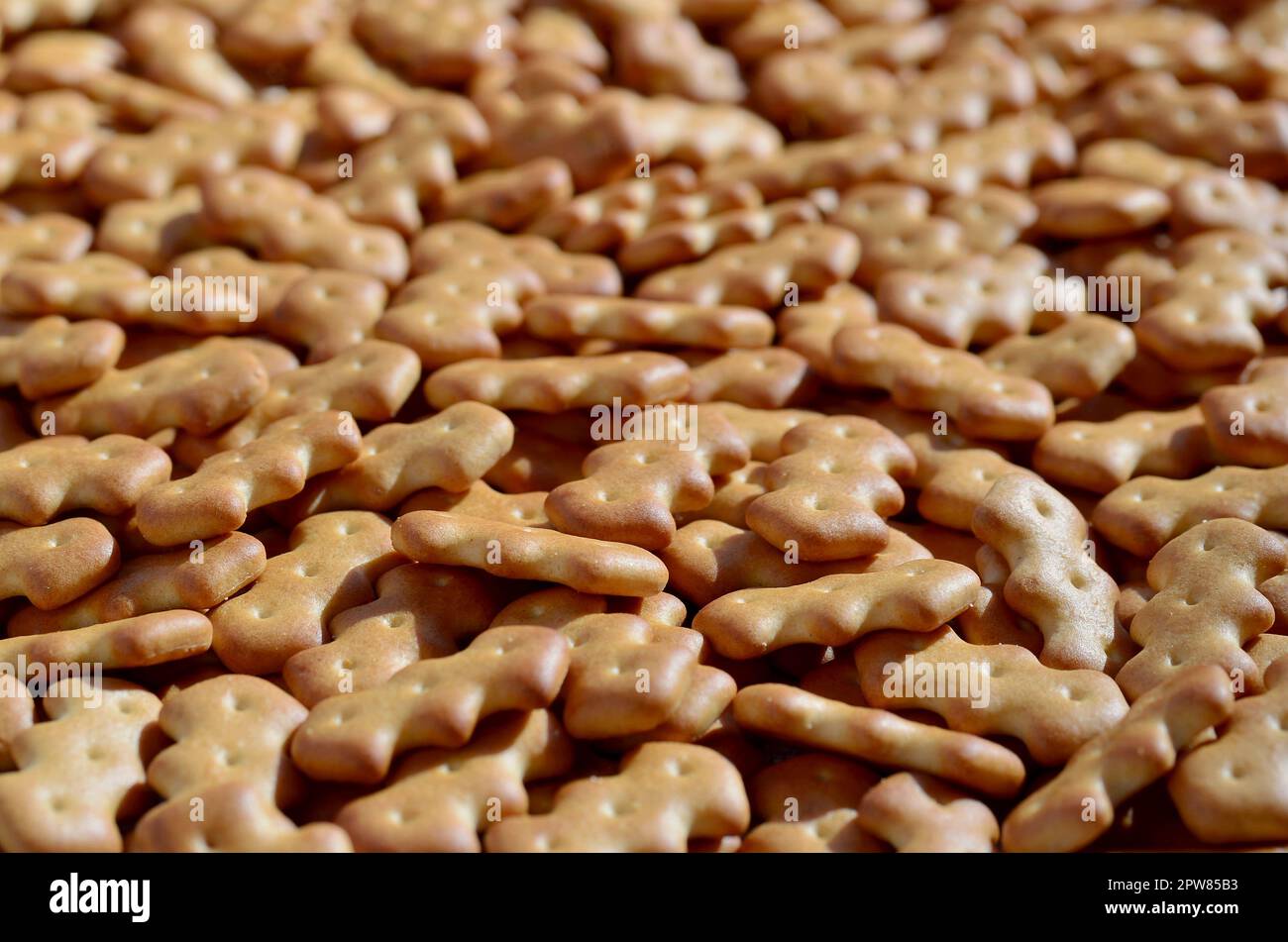 A huge bunch of salted biscuits of small sizes as a closed pattern or ...