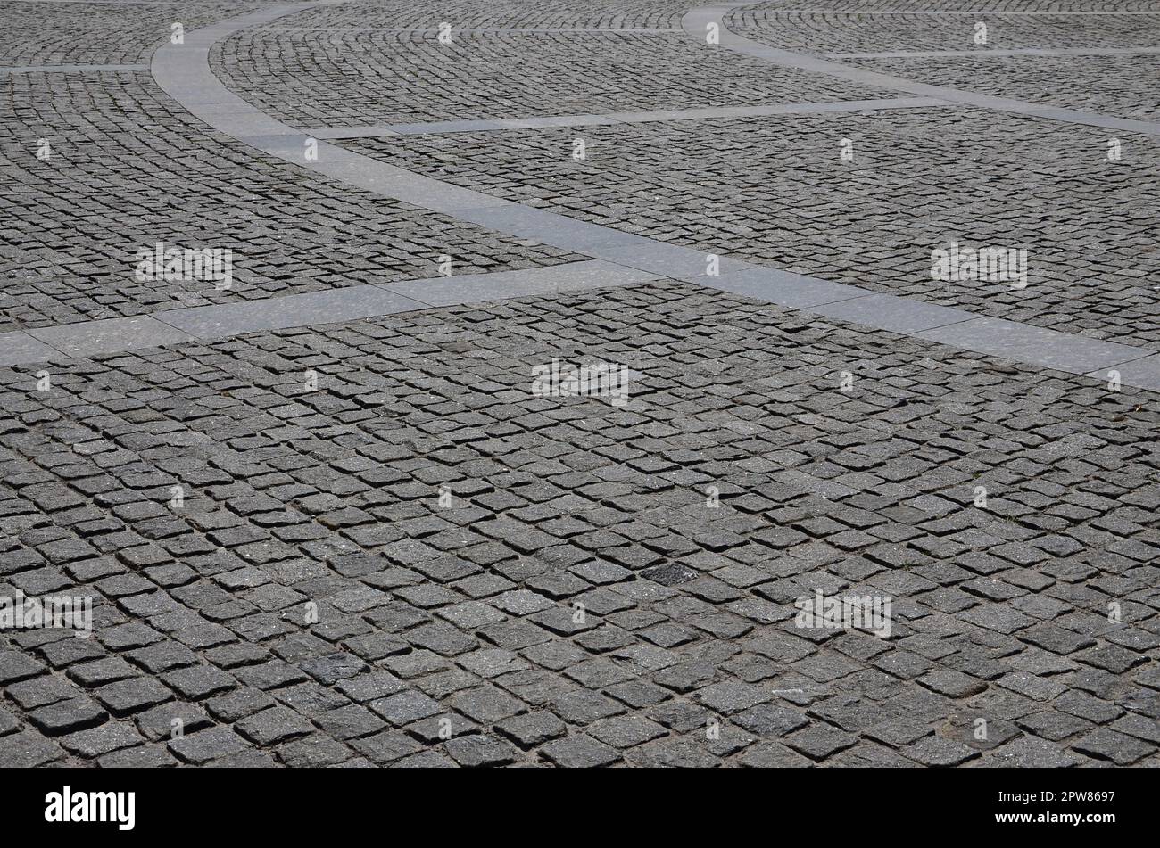 The texture of the paving slab (paving stones) of many small stones of ...