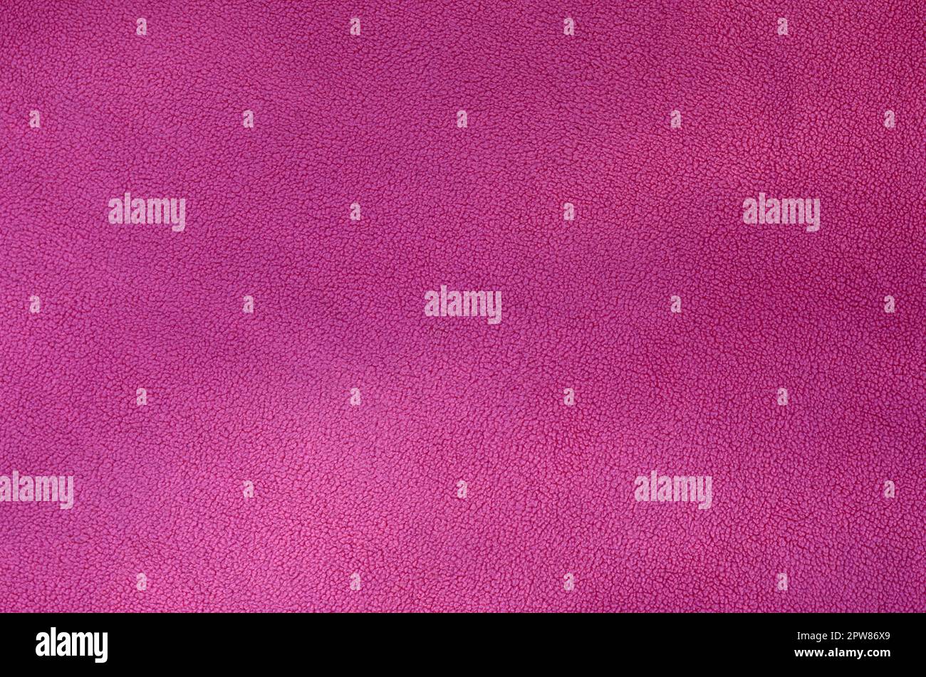 The blanket of furry pink fleece fabric. A background texture of light ...