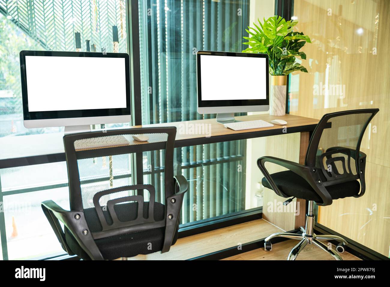 Workspace desk. Computer desktop blank screen in front of window in ...