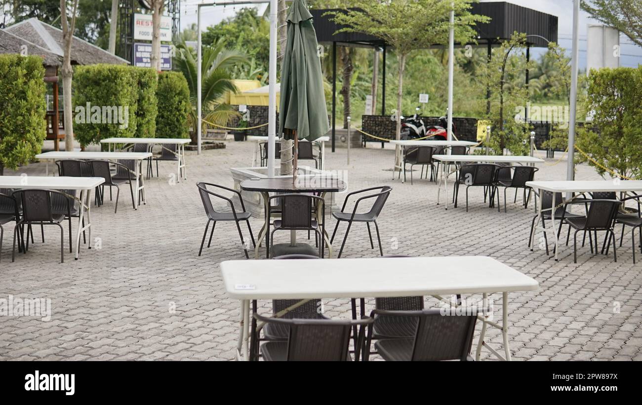 outdoor cafe with table and chair Stock Photo - Alamy