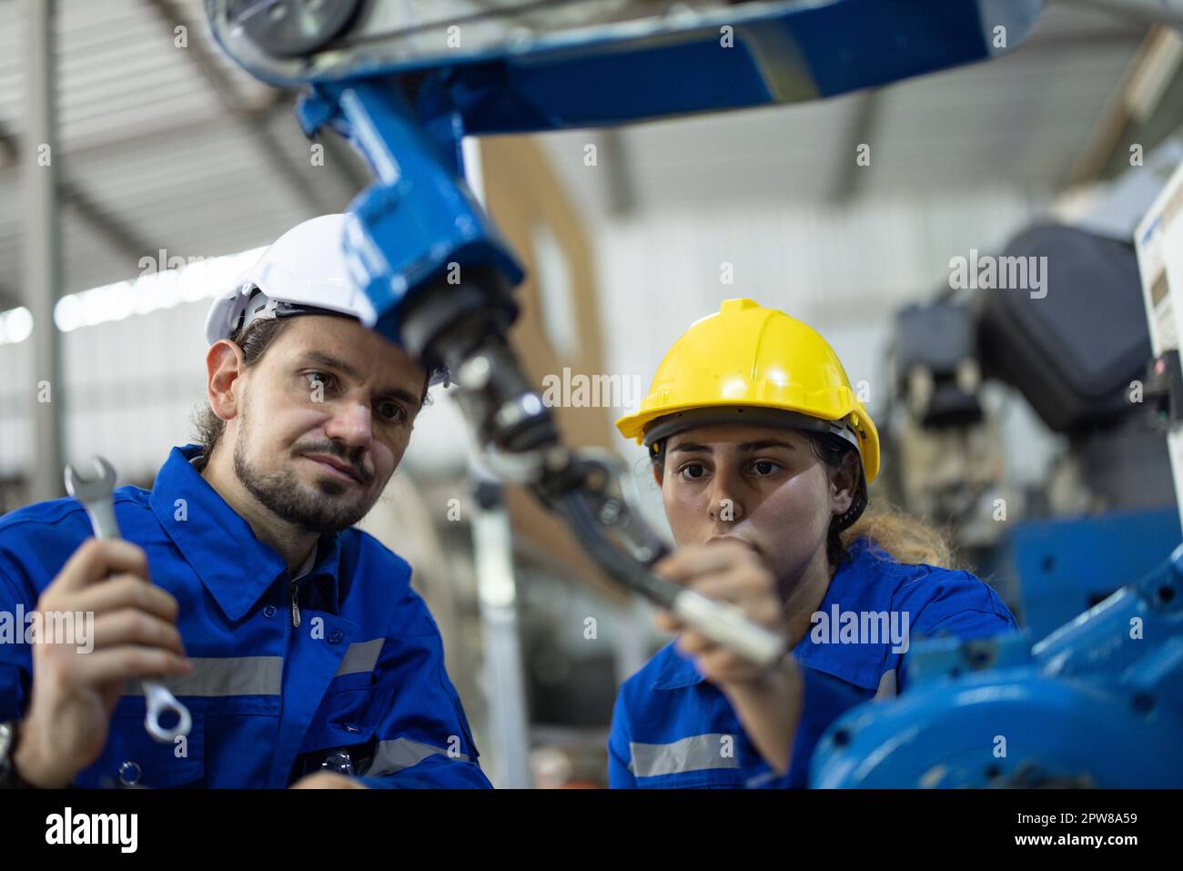 Robotic technicians tighten and loosen components with screwdriver and ...