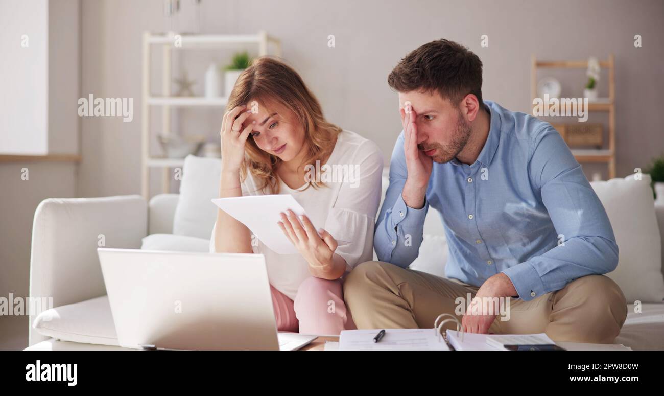 Shocked Couple Reading Bad News Letter. Bill Mail Stock Photo - Alamy