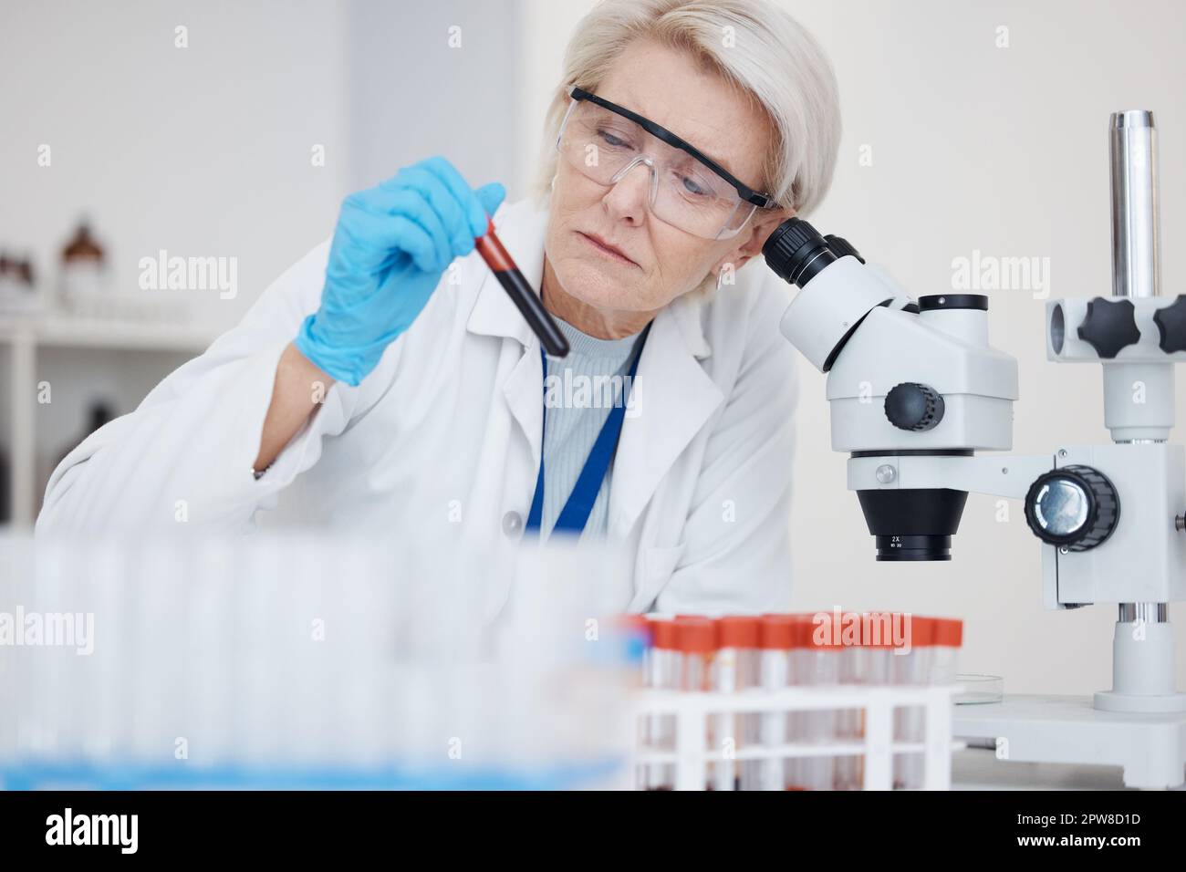 Medical science, blood test and analysis with scientist woman a vial ...