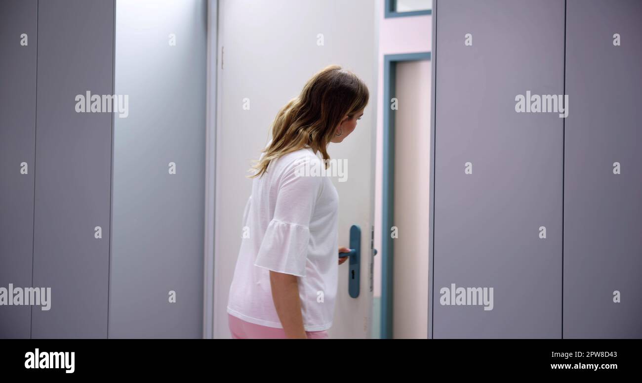 Pretty Looking Girl Opening Door Lock In Modern House Interior Stock ...