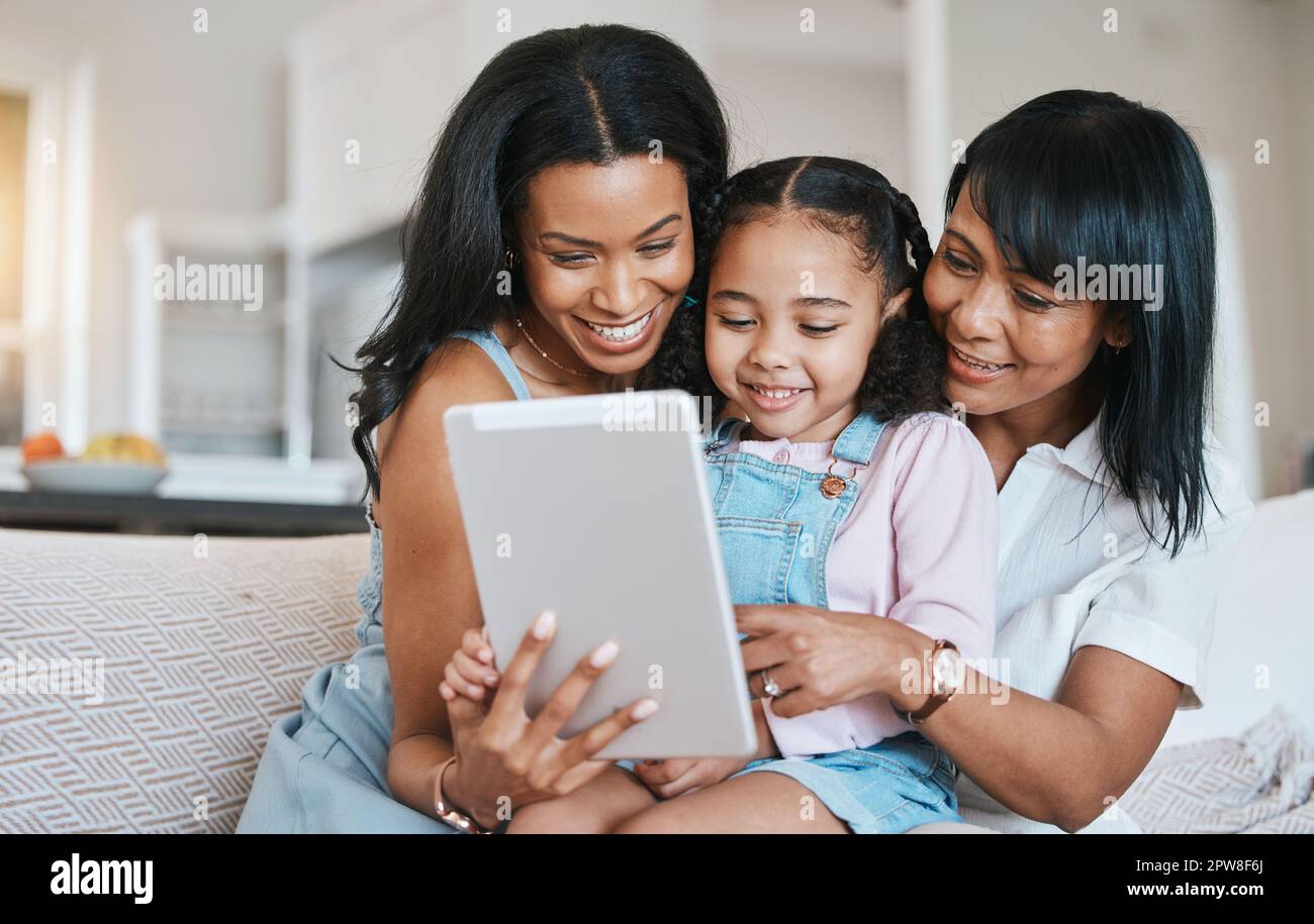 Family, tablet and child on a children education app with mother and ...