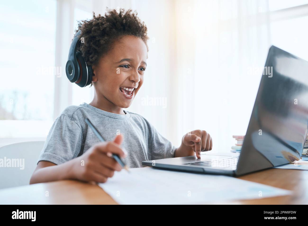 Learning, laptop and headphones of child for online education, language ...