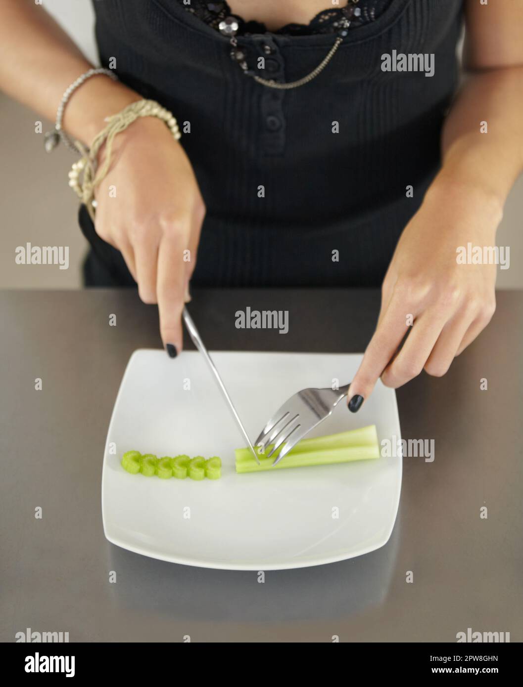 Closeup, vegetable and woman with anorexia, kitchen and eating disorder ...