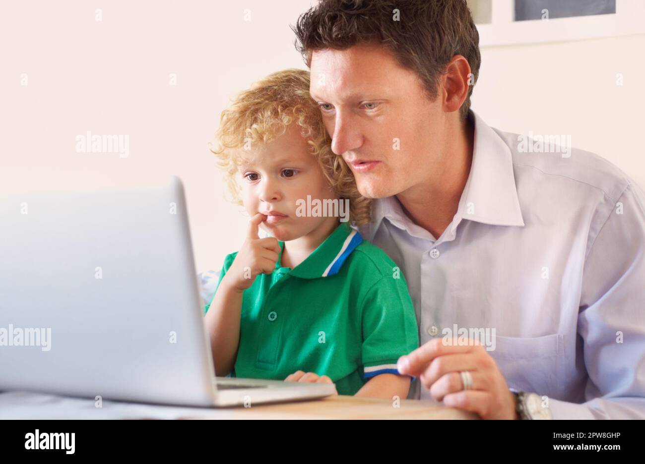 Laptop, elearning and father with kid in home for homework, homeschool ...