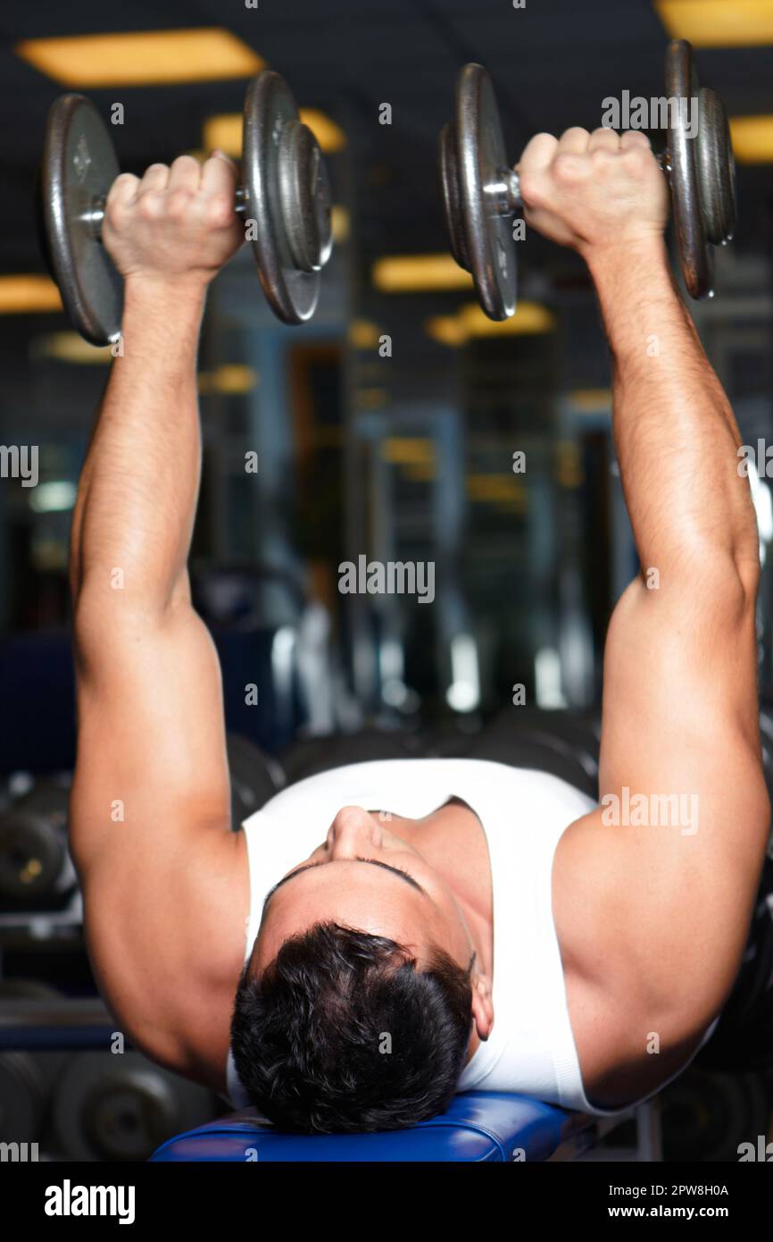 Fitness, dumbbell bench press and man doing workout performance, gym ...