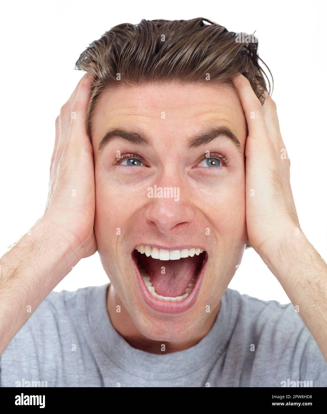 Excited, face and man closeup in a studio with happiness from deal and ...