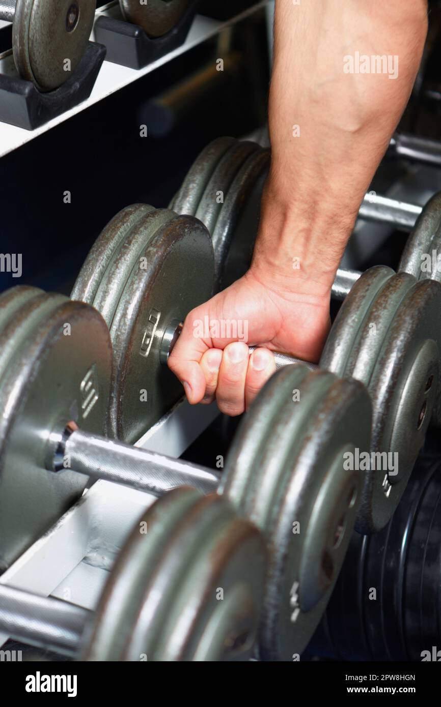 Hands, arm dumbbell workout and man doing power exercise, club fitness ...
