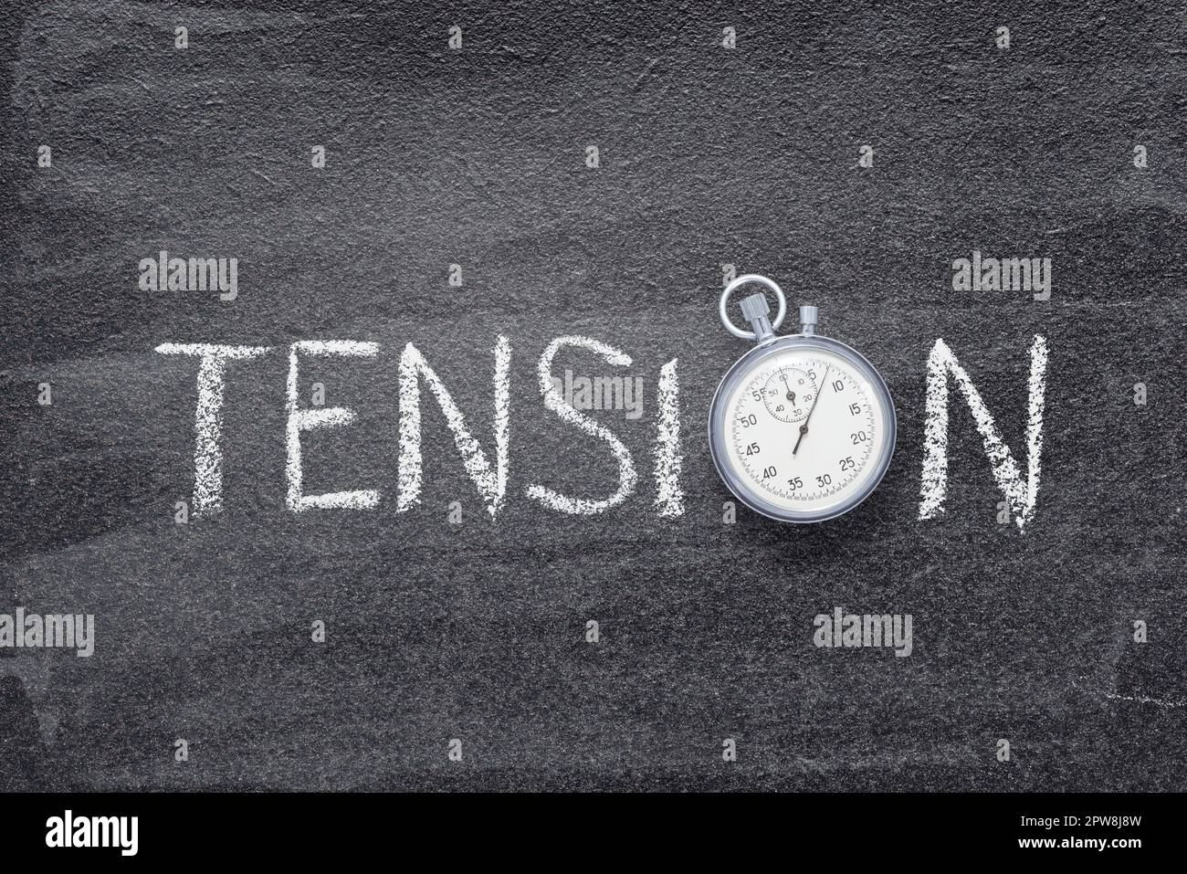 tension word written on chalkboard with vintage stopwatch used instead ...