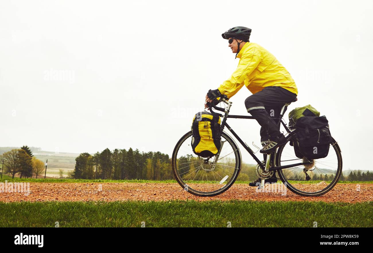 Dont use the weather as an excuse. Full length shot of a male cyclist ...