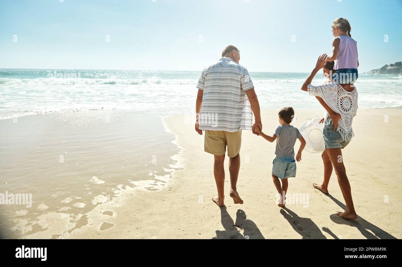Summertime bonding at the beach. a family enjoying some quality time ...