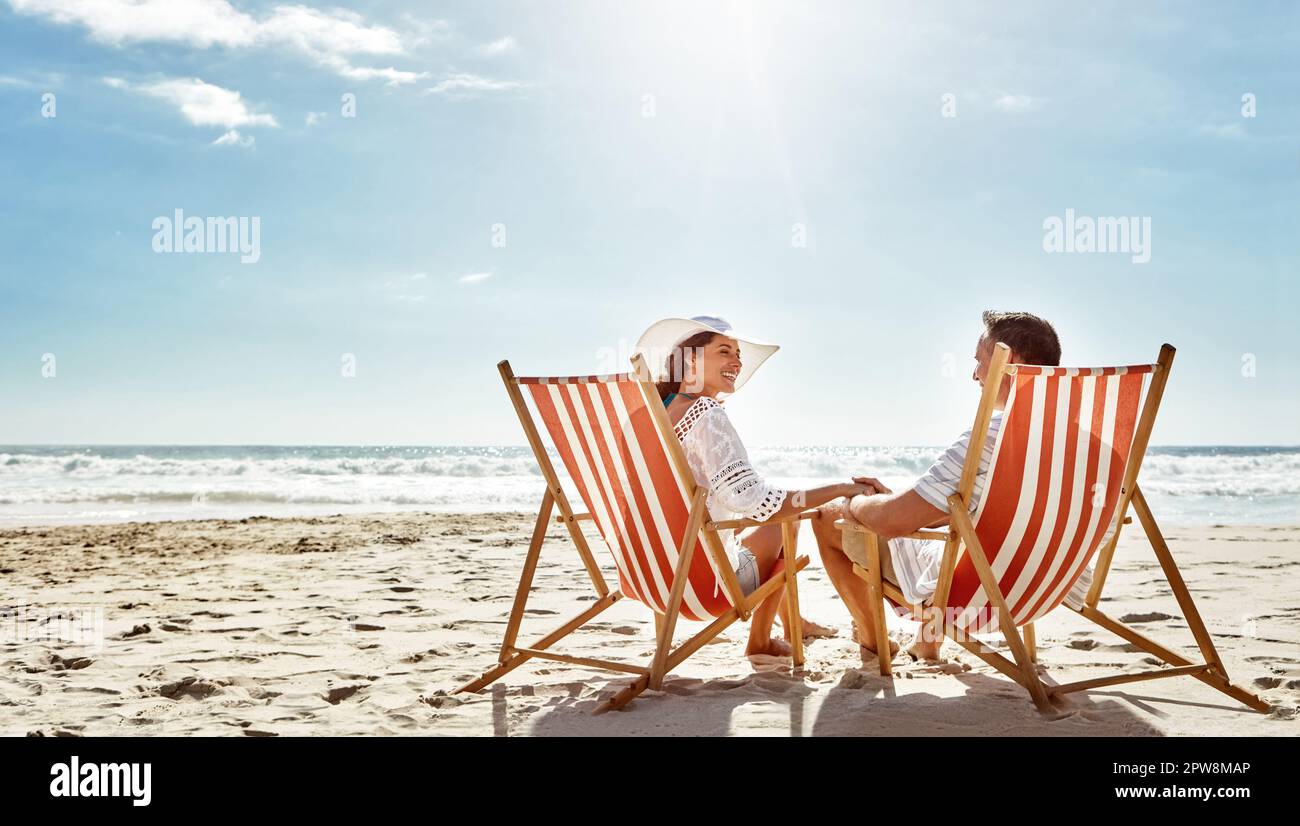 Soaking up some good times together. a mature couple relaxing together ...