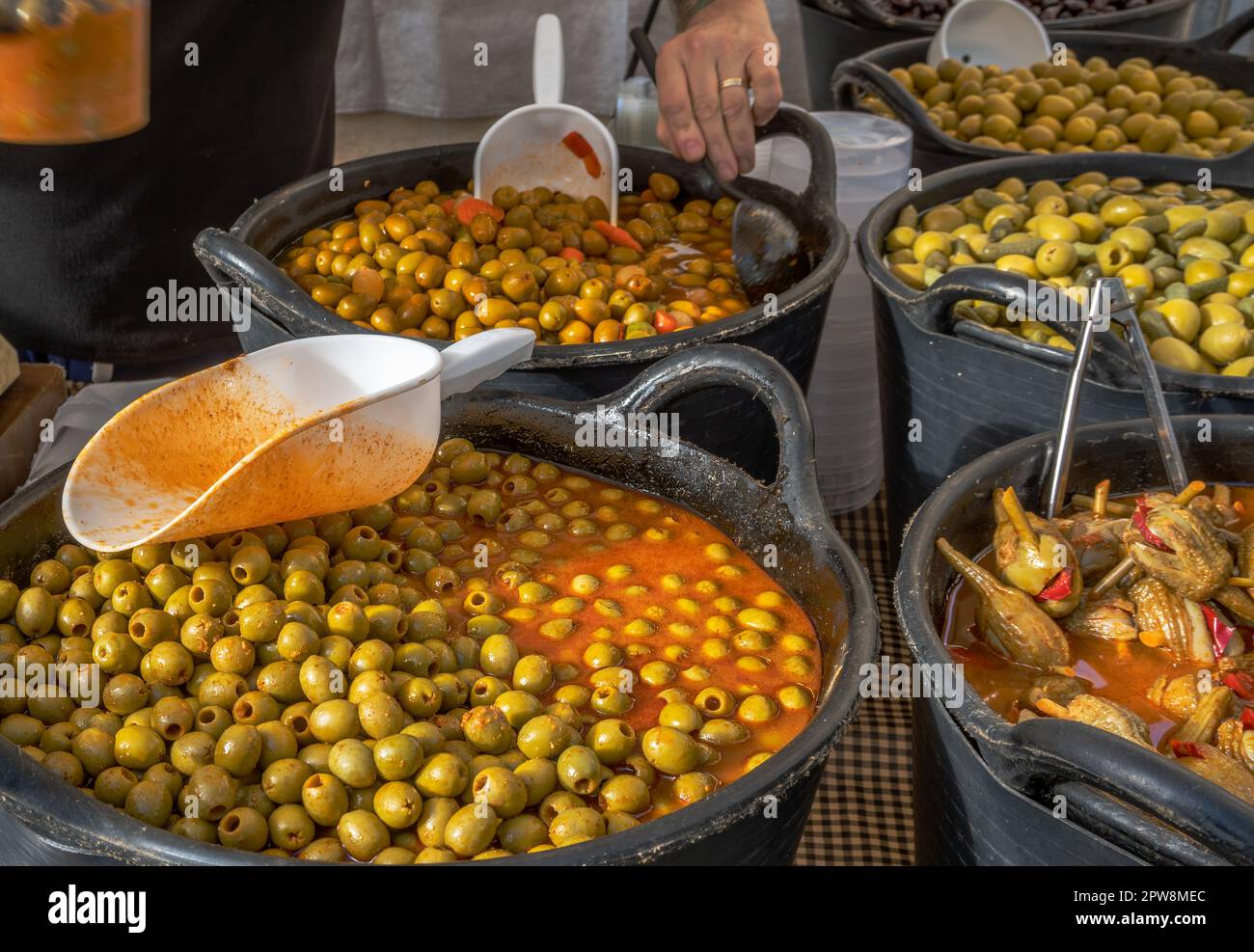 Wide selection of olives and aubergines in almagro pickle at a food ...