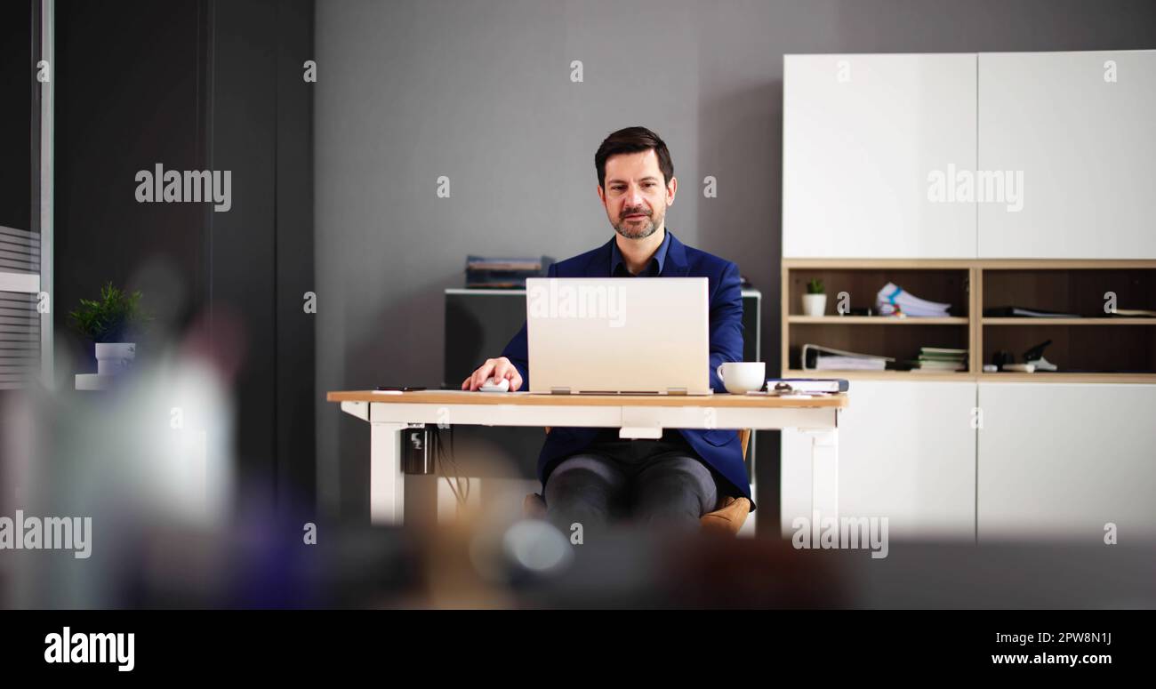 Happy Professional Man Employee Using Computer For Work Stock Photo - Alamy