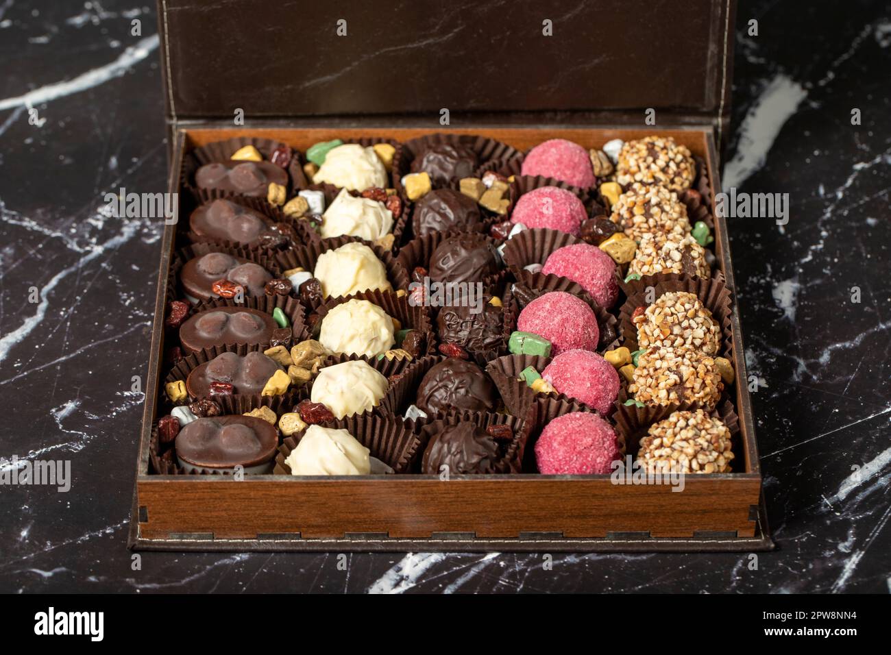 Packed chocolate box. Delicious truffle or praline chocolate assortment ...