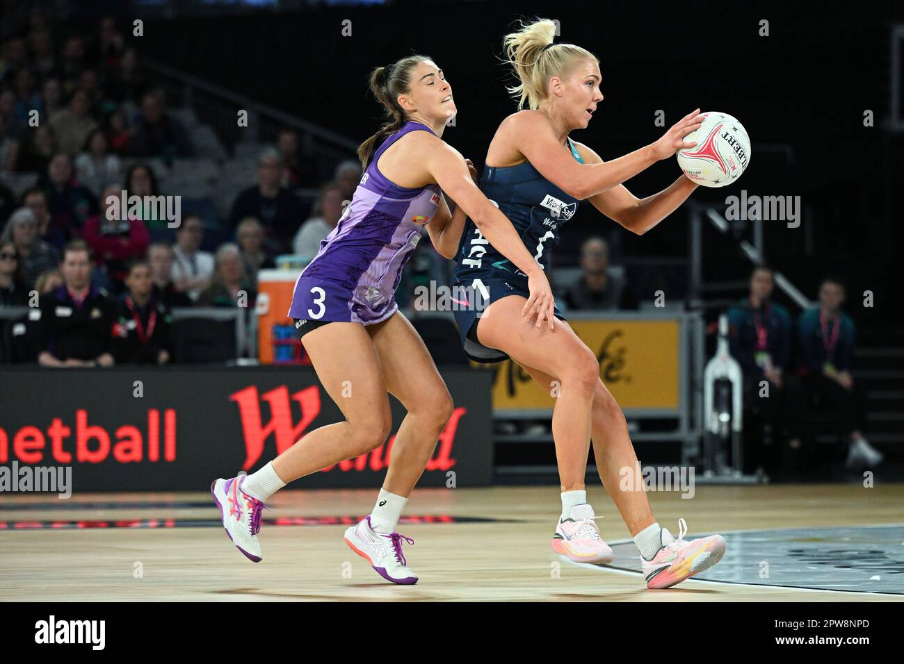 Kate Moloney of the Vixens (right) in action during the Super Netball ...