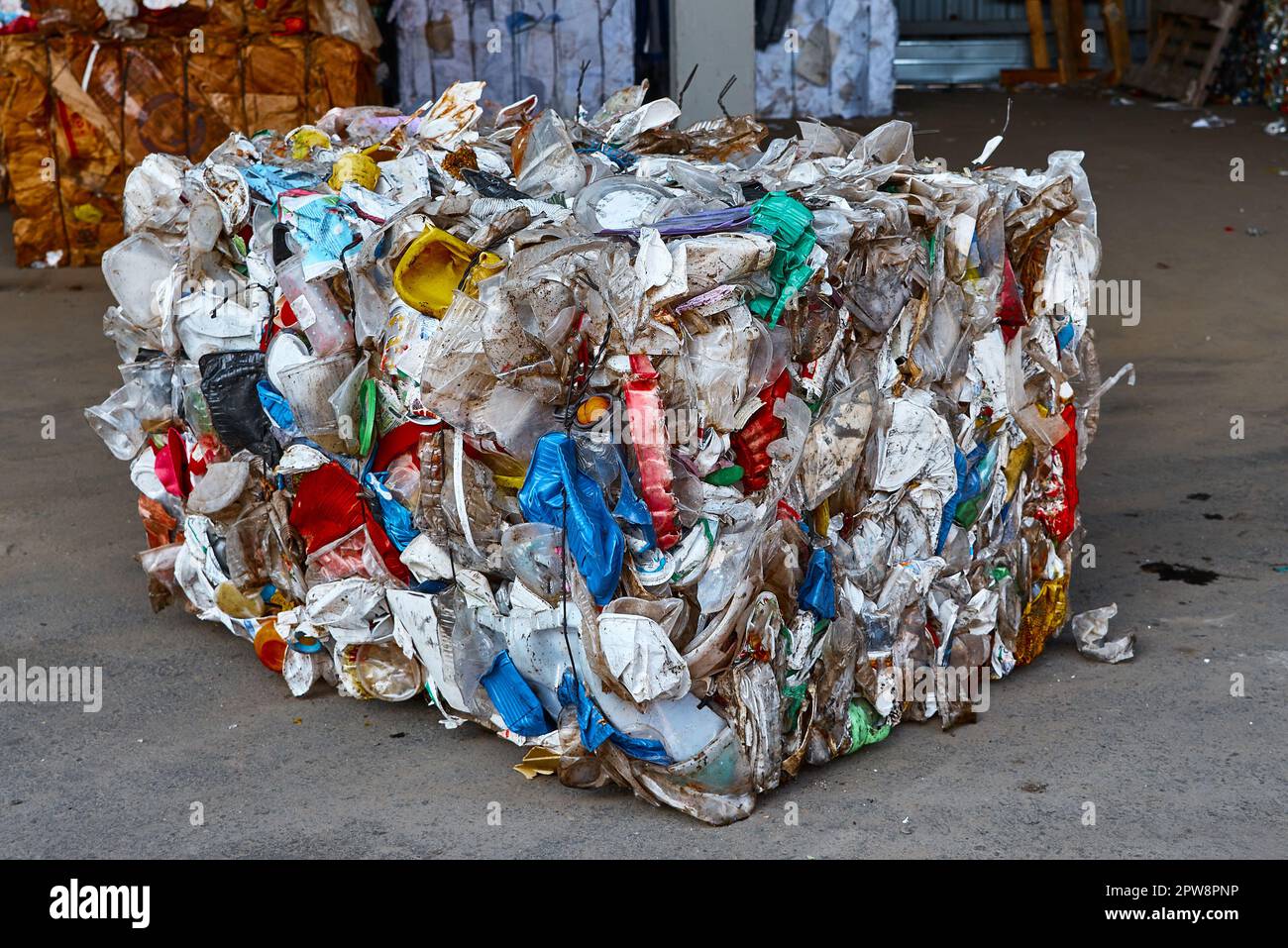 Block of pressed plastic bags at waste recycling plant Stock Photo - Alamy