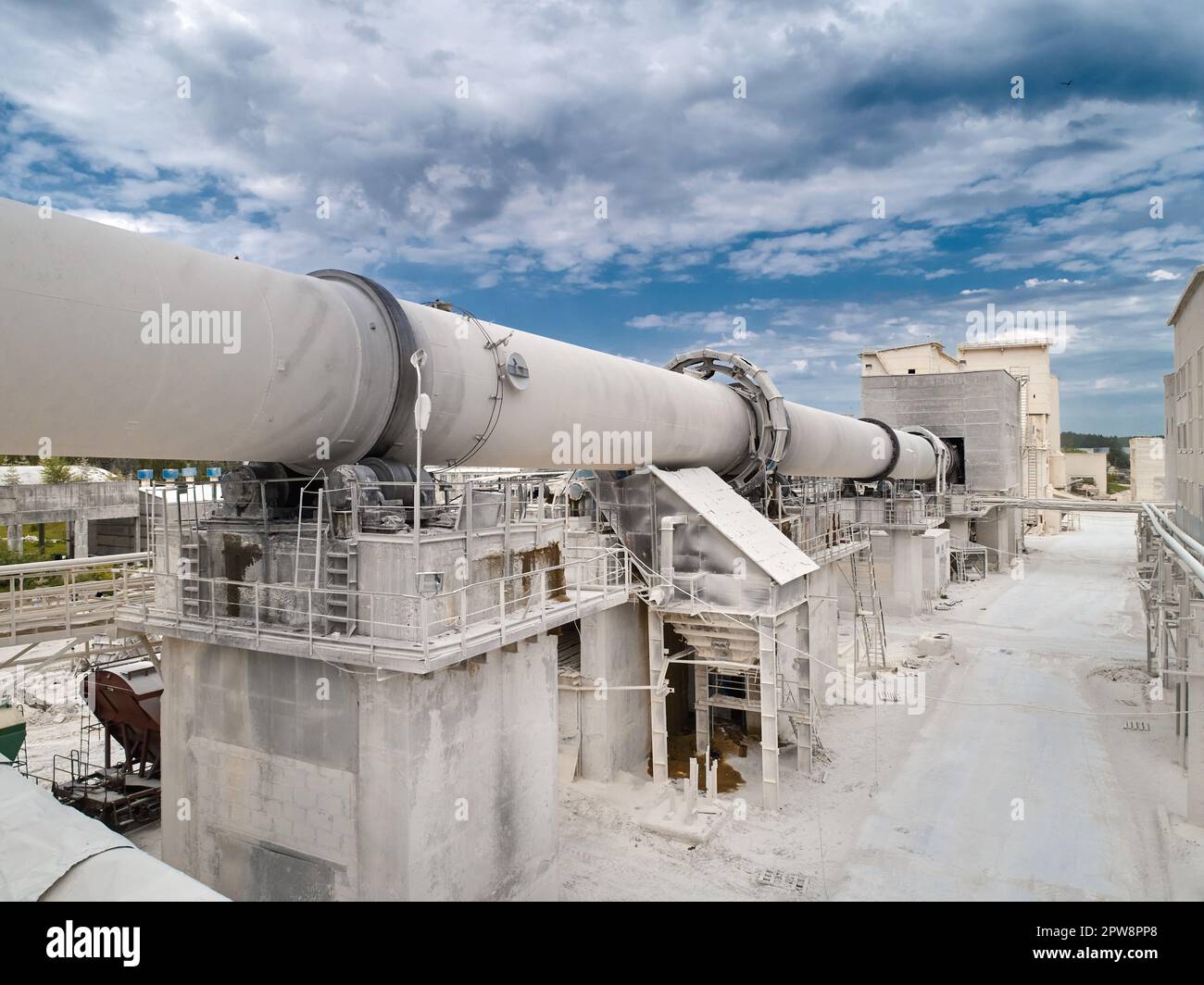 Limestone burning rotating furnace with large pipe at plant Stock Photo ...