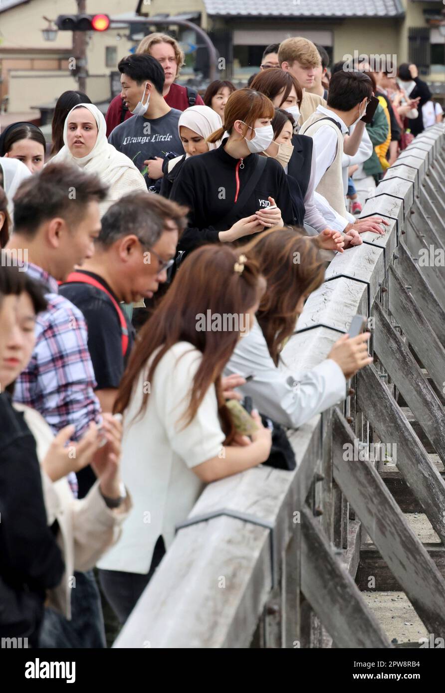 Many people gather at a sight seeing site, Arashiyama area, in Kyoto on ...