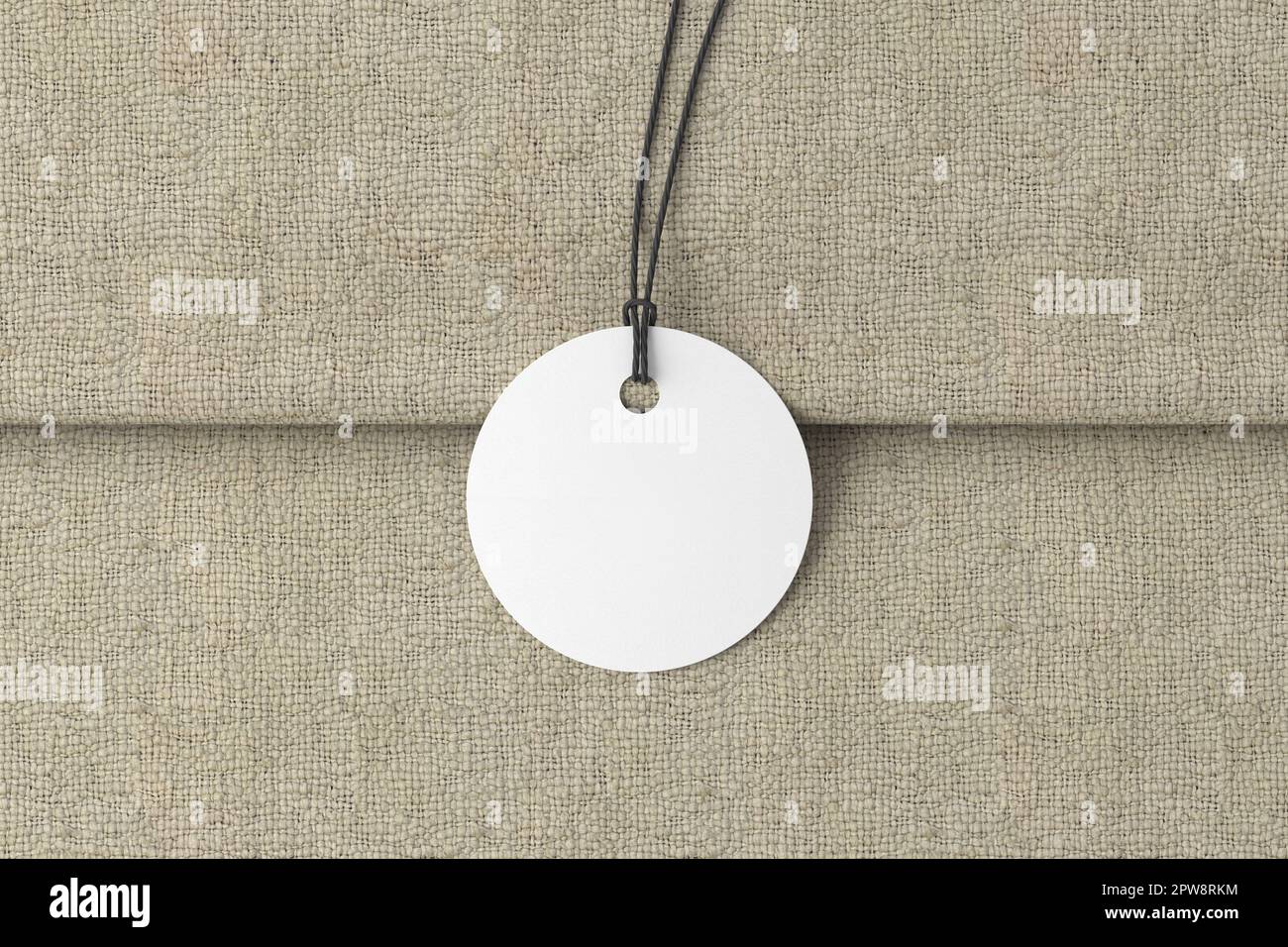 White round tag mockup on fabric background. View directly above Stock ...