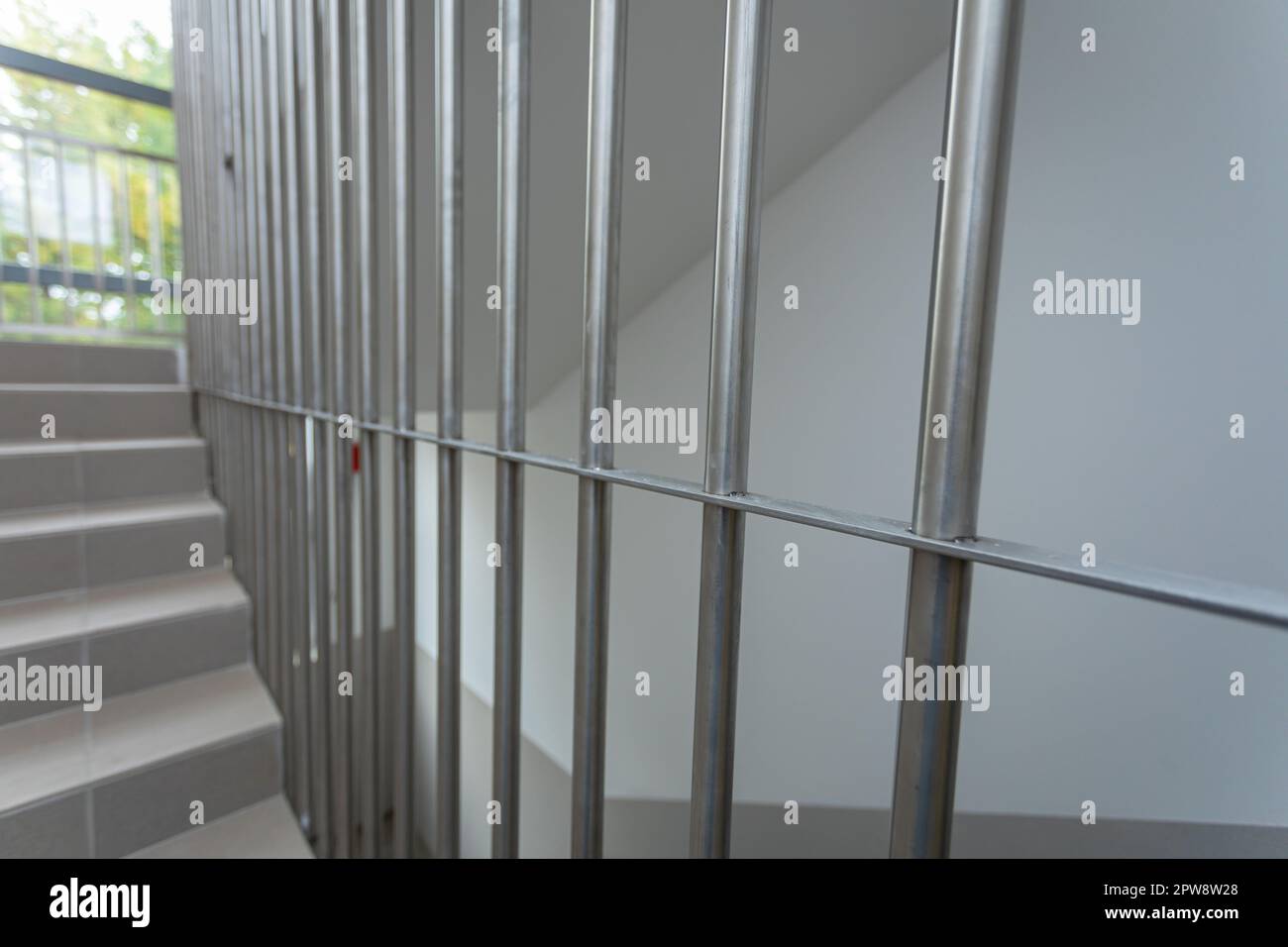 Protection made of rods as an infill of the balustrade on the staircase ...