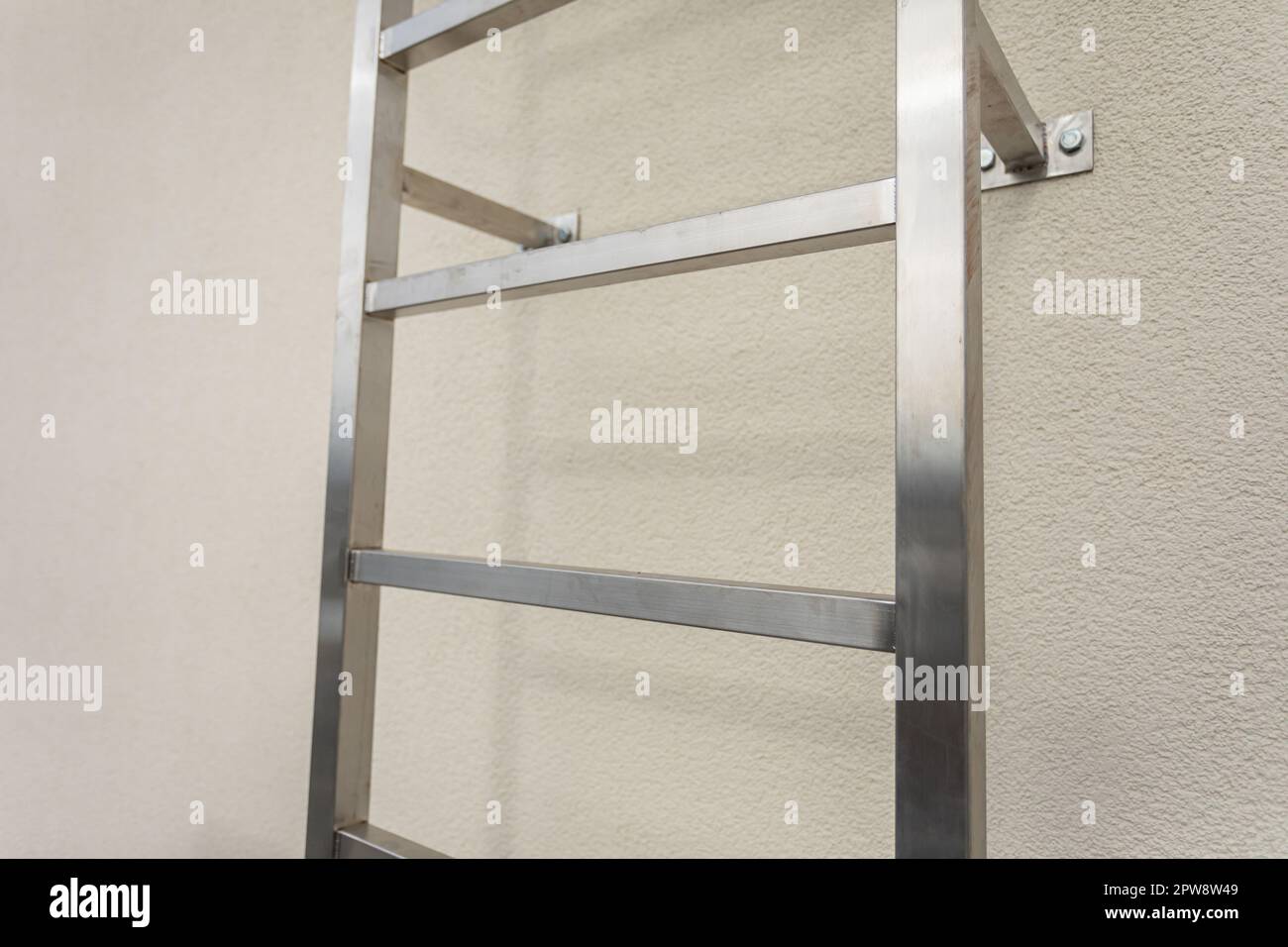 Metal ladder fixed to wall hi-res stock photography and images - Alamy