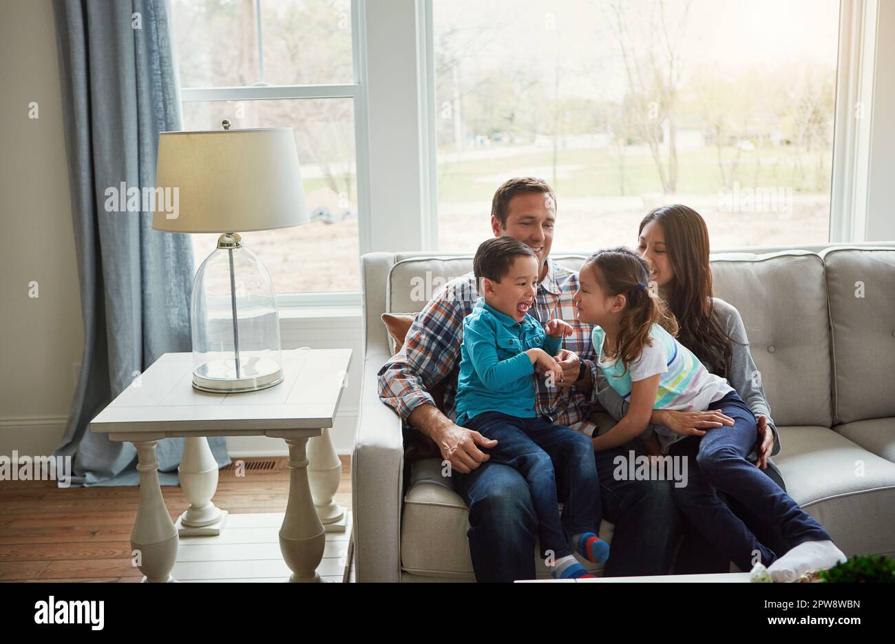 The happiest times are those spent with family. a happy young family of ...