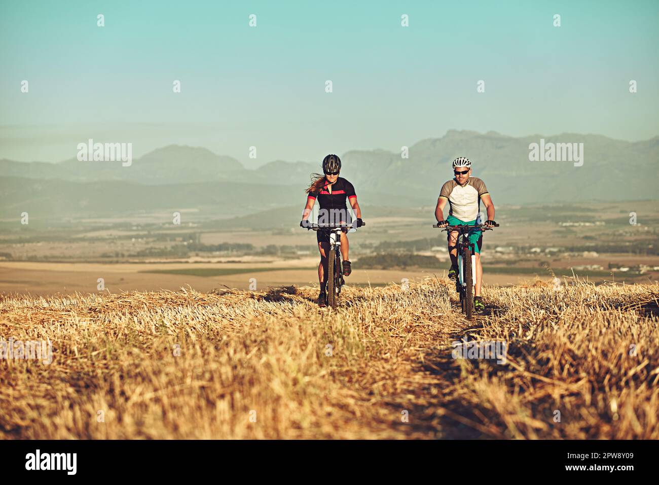 Making the most of simple pleasures. two cyclists out cycling in the ...