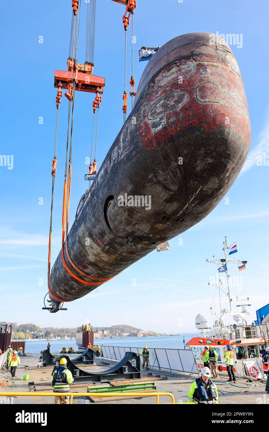 Kiel, Germany. 28th Apr, 2023. The submarine U17 is loaded onto a ...