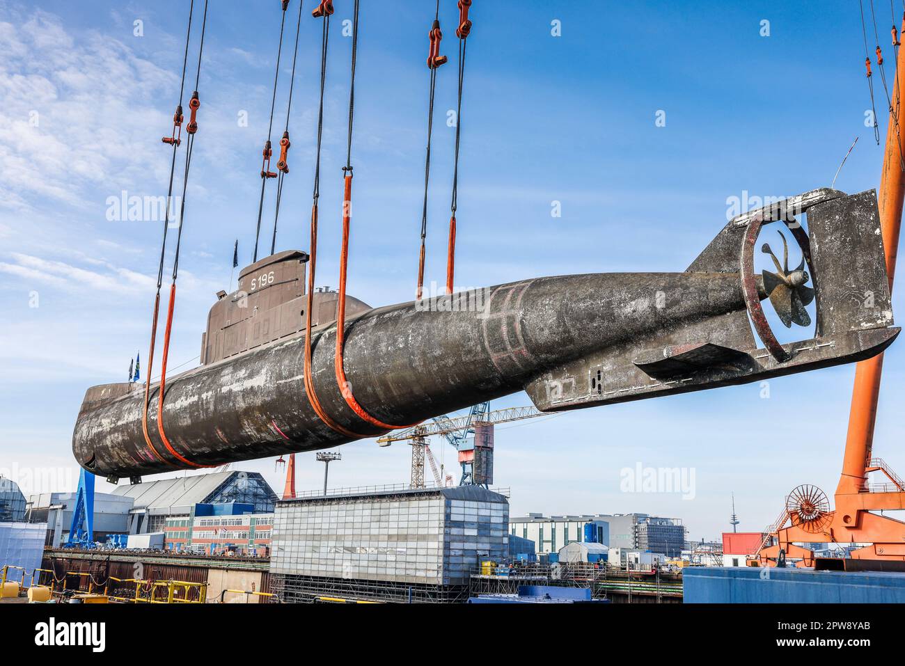 Kiel, Germany. 28th Apr, 2023. The submarine U17 is loaded onto a ...
